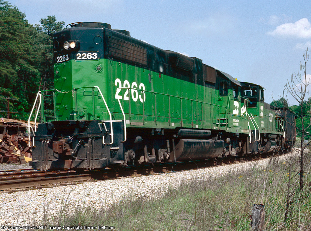 Burlington Northern GP38-2 #2263 and MP15DC #1004, leading the Jasper (AL) local, pass freight ...